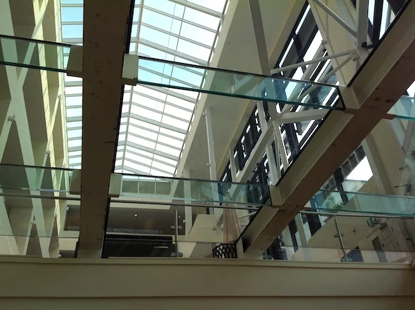 reception hall large structural glass floor multiple panels joined ...